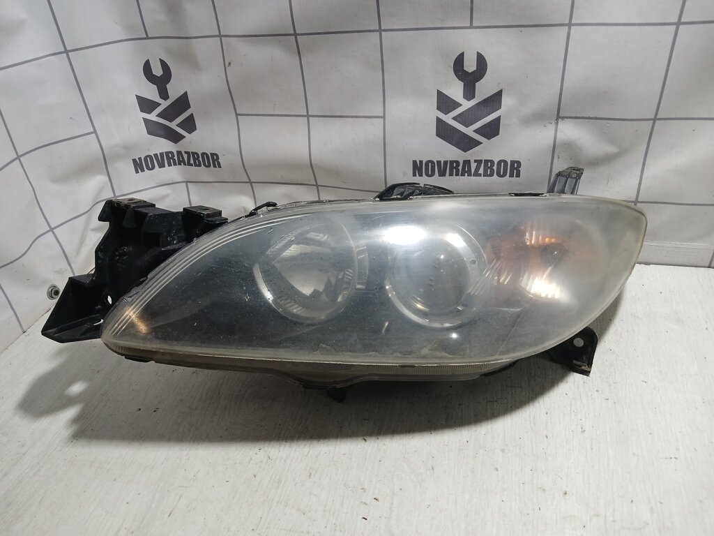 Фара левая Mazda Mazda 3 BK 02-09
