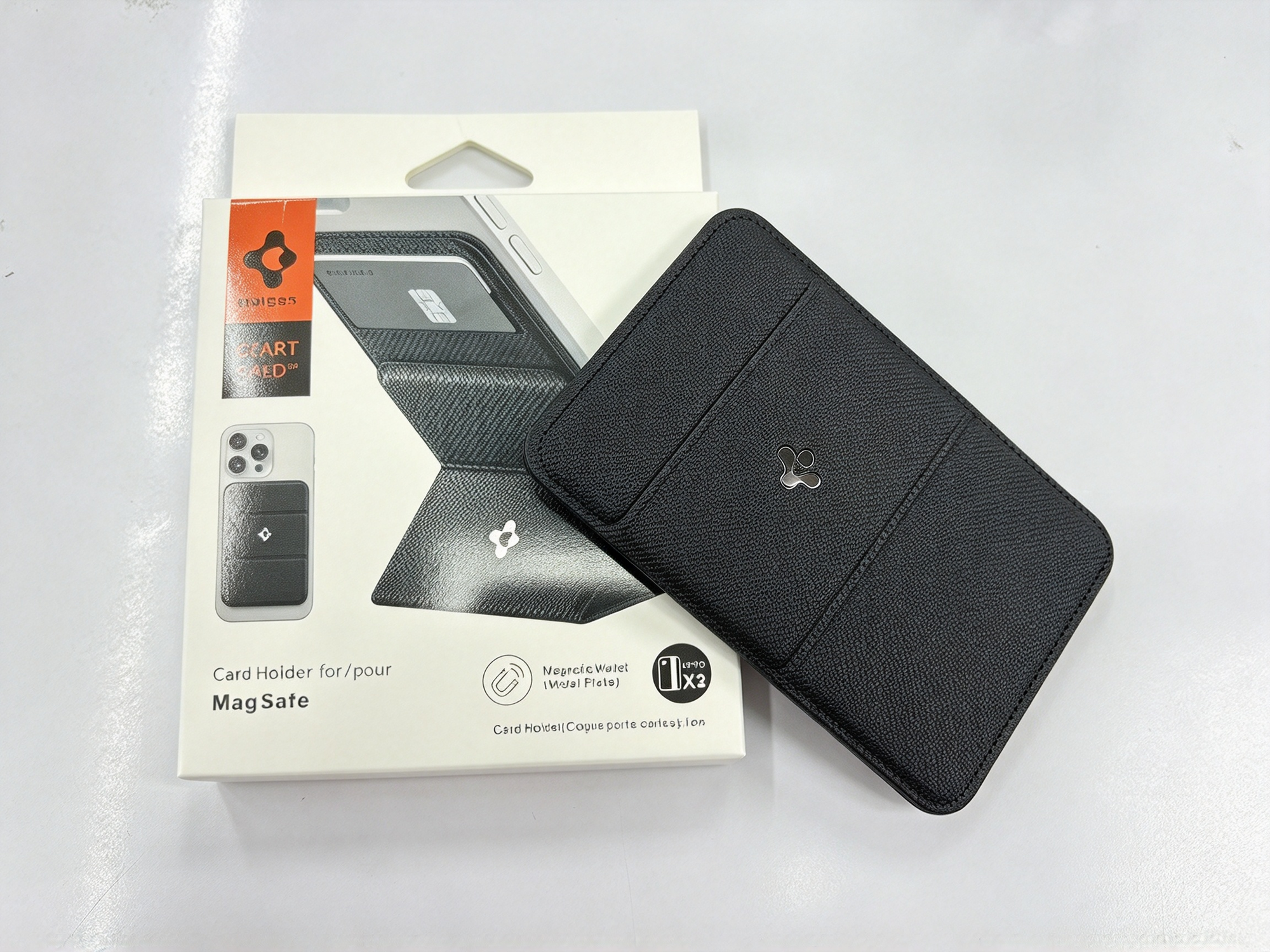 Картхолдер Spigen AMP02746. Черного цвета с функцией подставки.