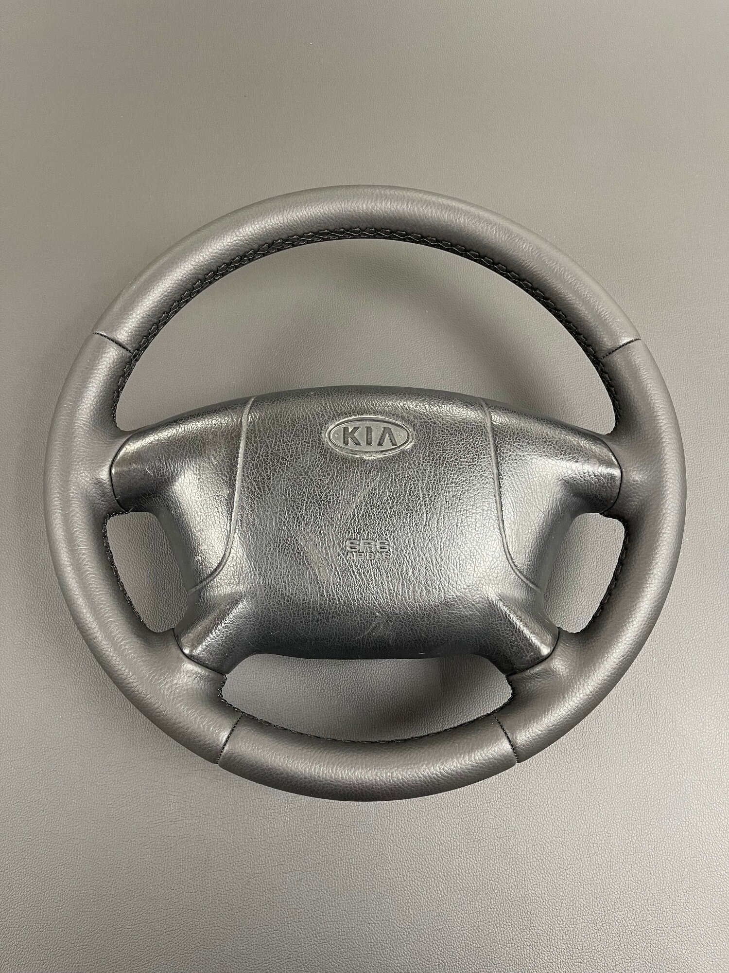 Руль Kia Rio 1 Б/У после перетяжки.