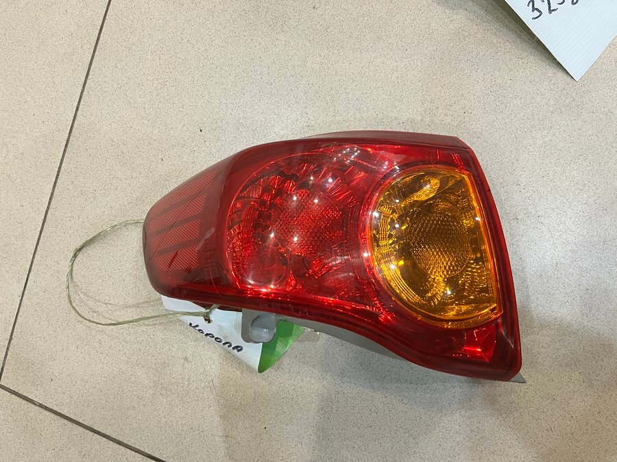 Фонарь задний наружный левый от Toyota Corolla E150 2006-2013