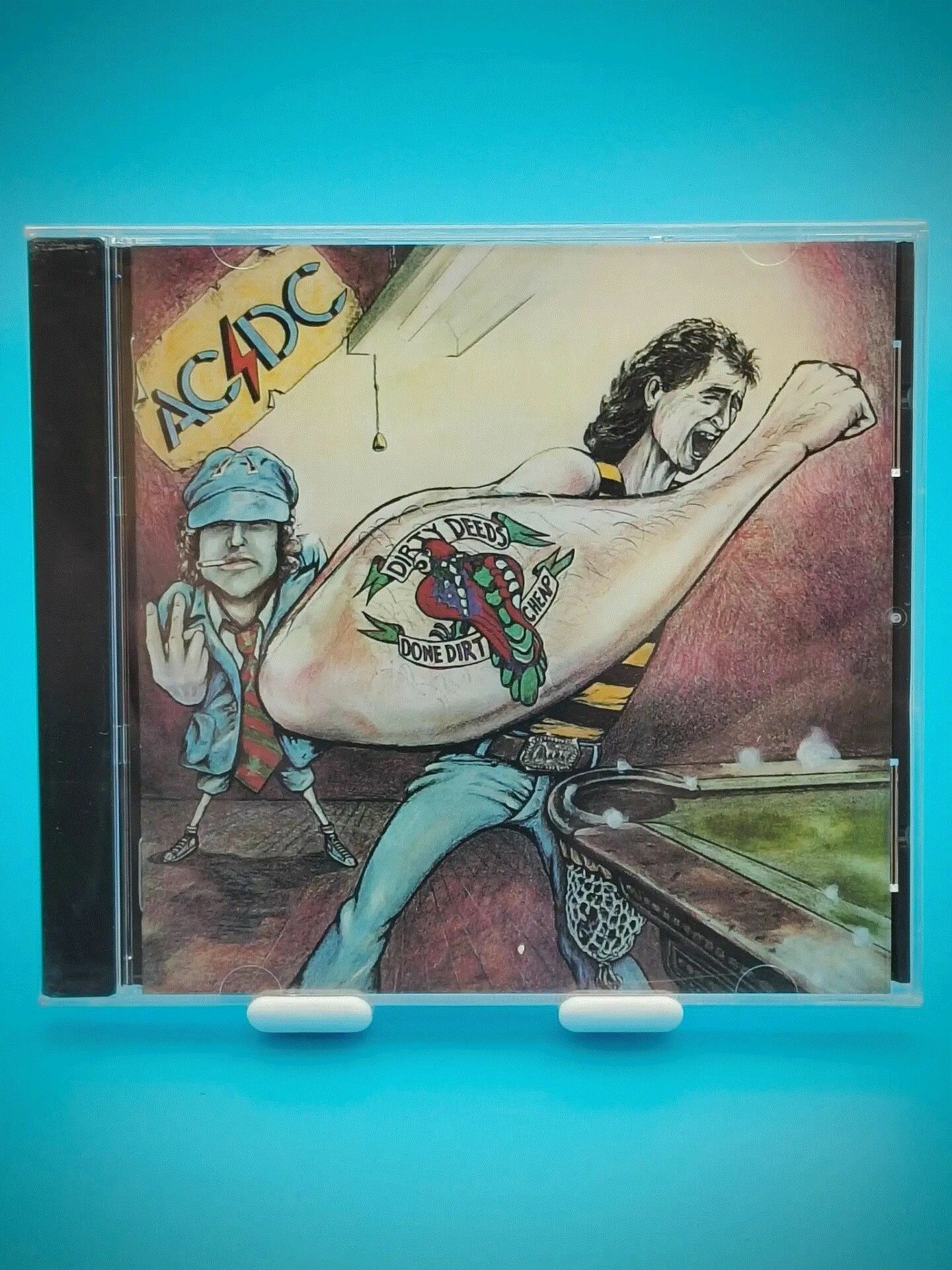 AC/DC: "Dirty Deeds Done Dirt Cheap", хард-рок (1976, CD диск)