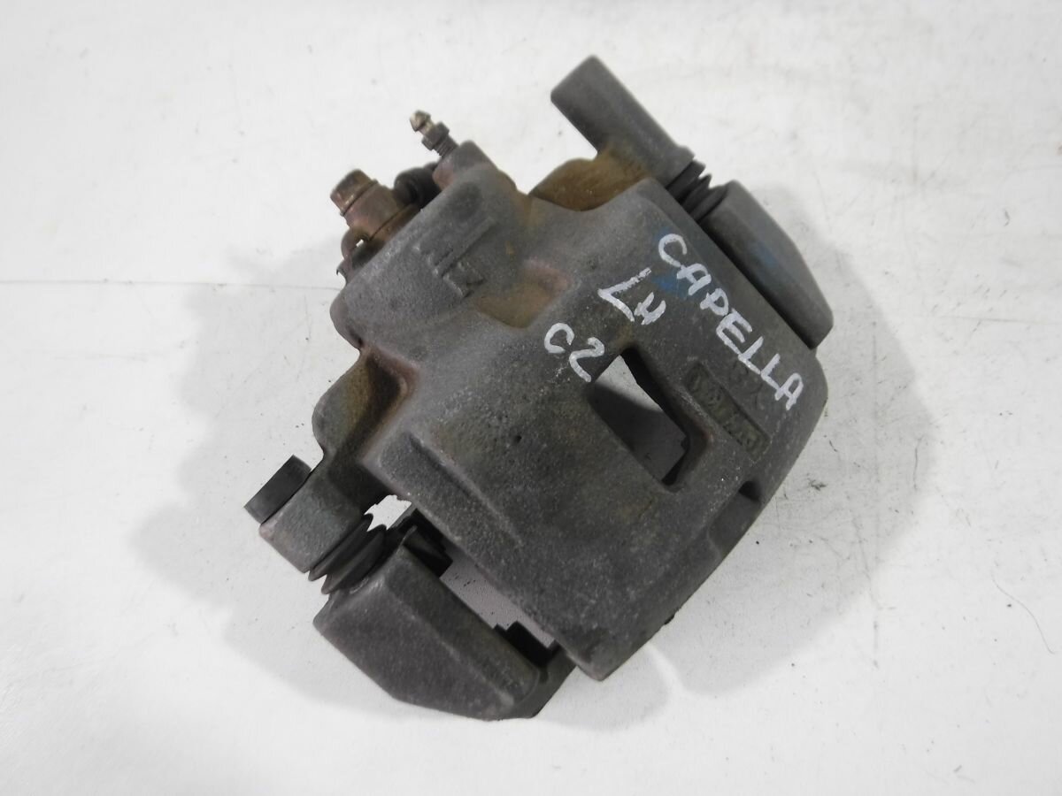 Суппорт тормозной передний левый Mazda Capella CG (1994—1997) G02K33990