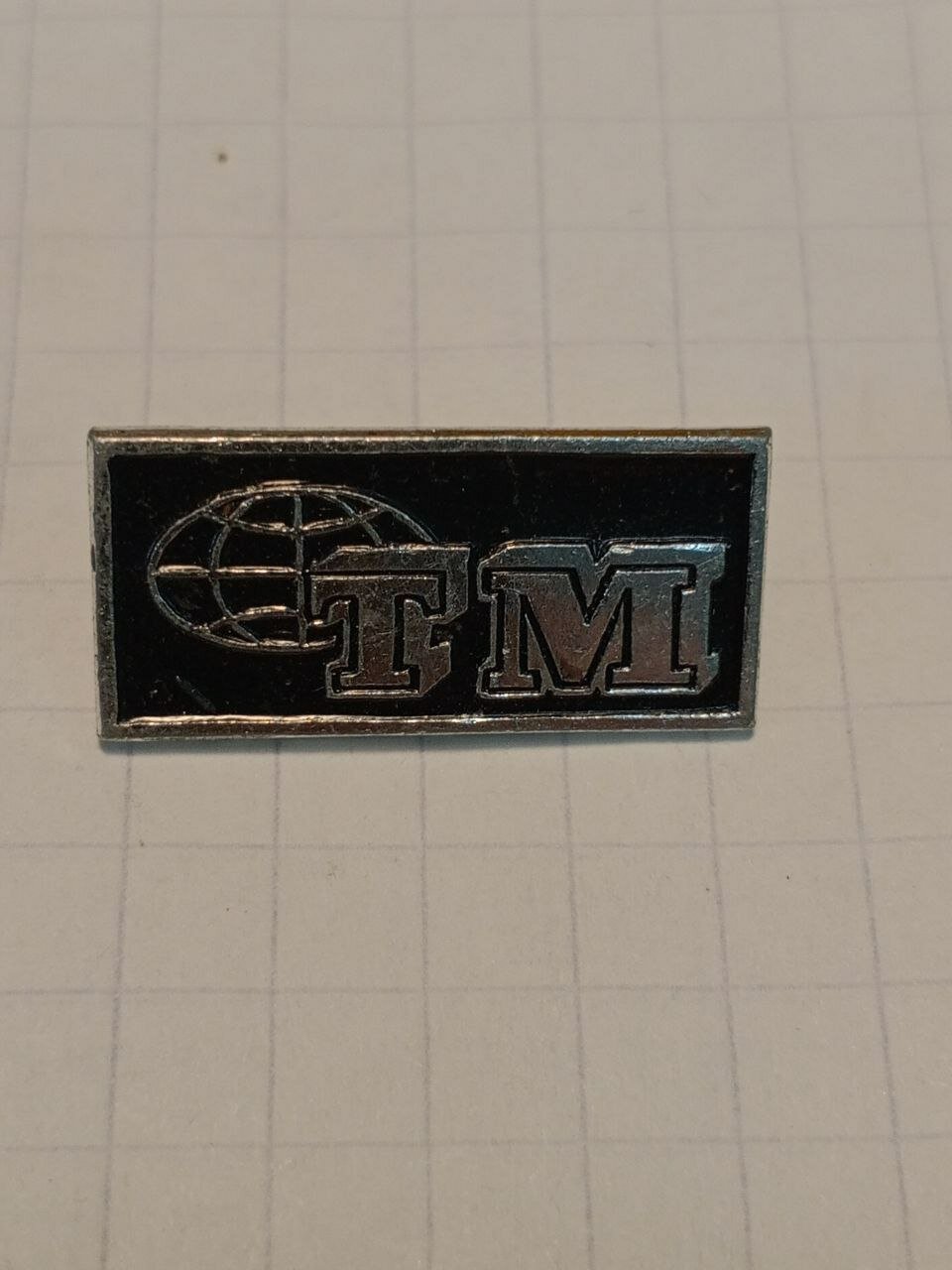 Значок "TM с глобусом"