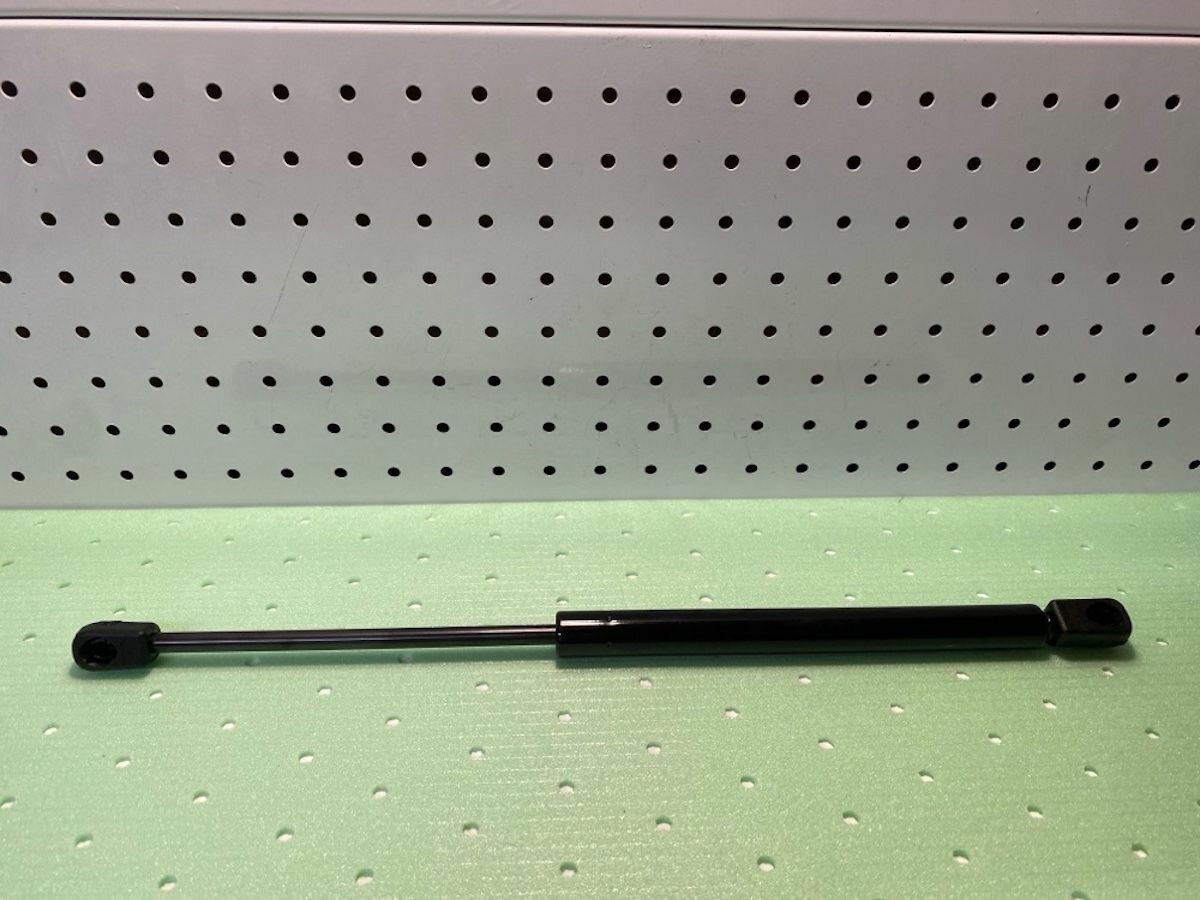 Амортизатор бокового ящика кабины VOLVO FH FM (вольво ФШ ФМ)