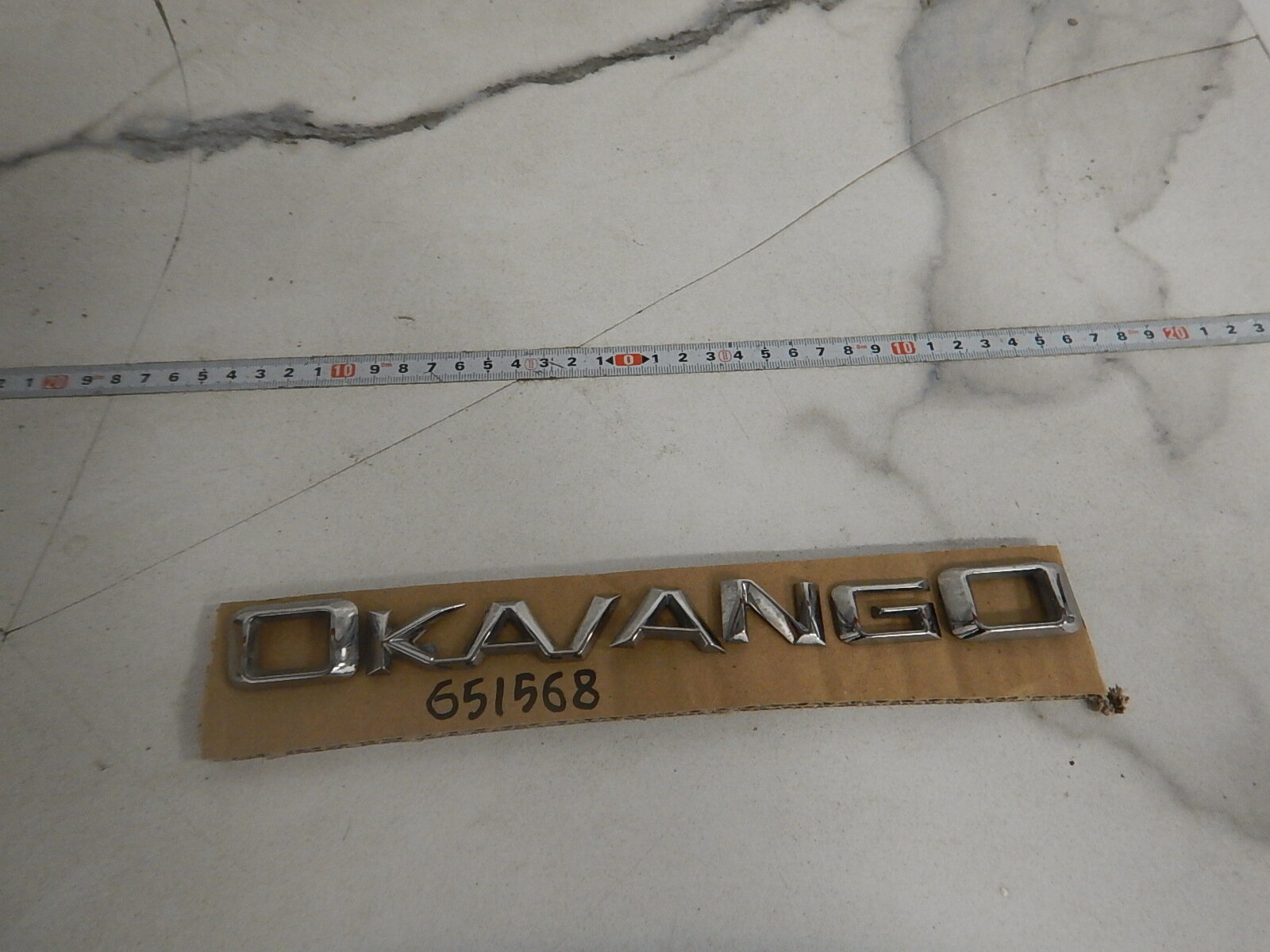 Б/У Эмблема на крышку багажника, Geely (Джили)-OKAVANGO (20-) GEELY OKAVANGO (20-) Потертости. 651568 GEELY арт. 6608129638