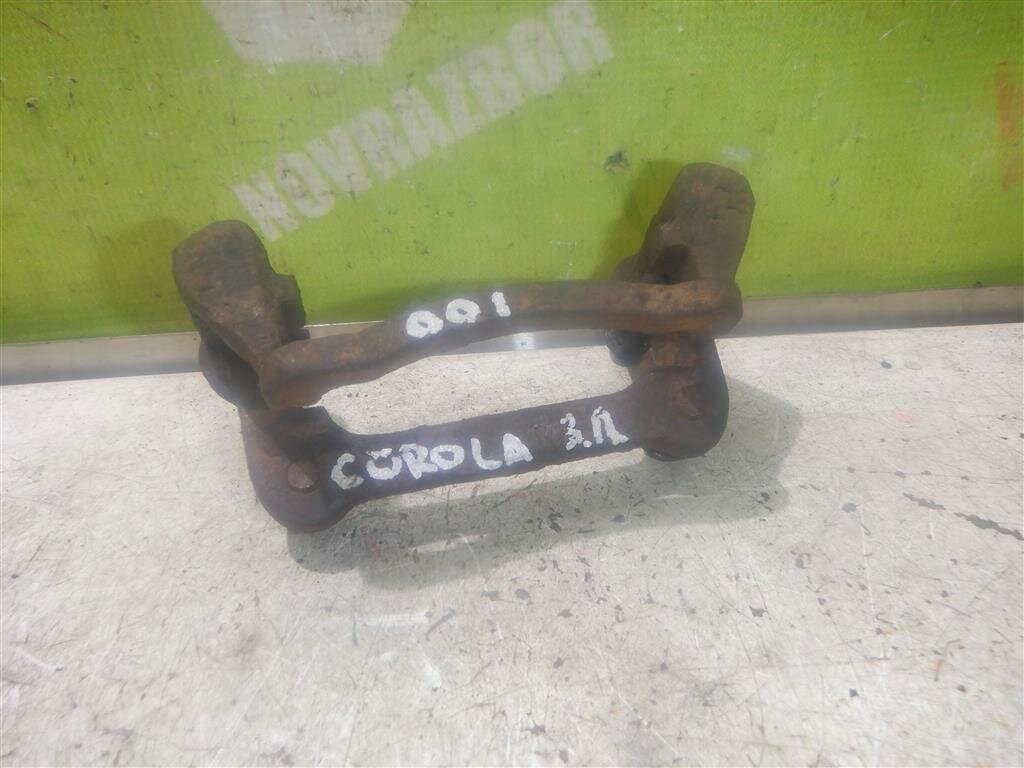 Скоба суппорта заднего Toyota Corolla E12 2001-2006