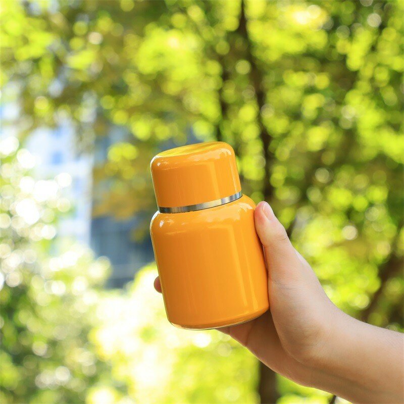 Modern minimalist 316 stainless steel insulated cup with tea filter for office and travel orange