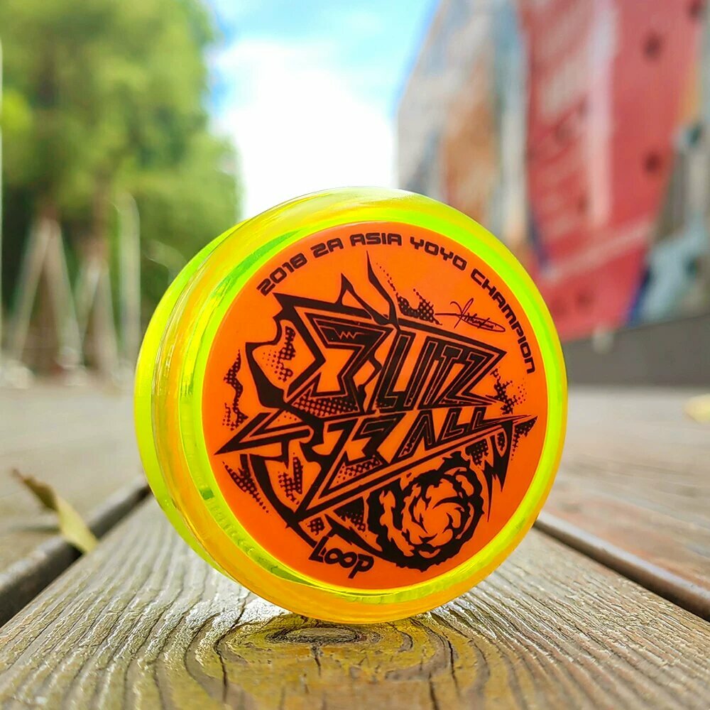 Светящийся желтый yo-yo с оранжевой крышкой и черными надписями - яркий старт