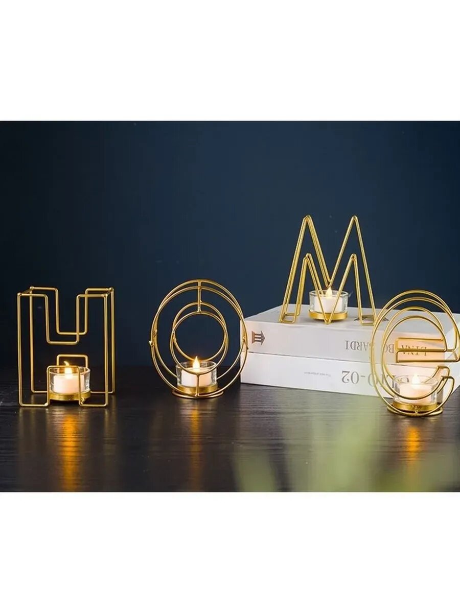 Золотой металлический подсвечник с надписью "HOME"