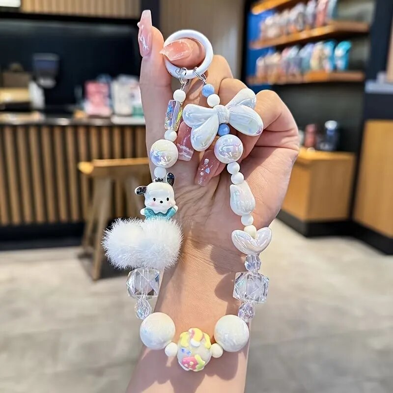 Многофункциональный брелок-браслет Sanrio с помпонами (My Melody, Kuromi, Cinnamoroll) - Для телефона, камеры, рюкзака или как браслет, ручная роспись бусин