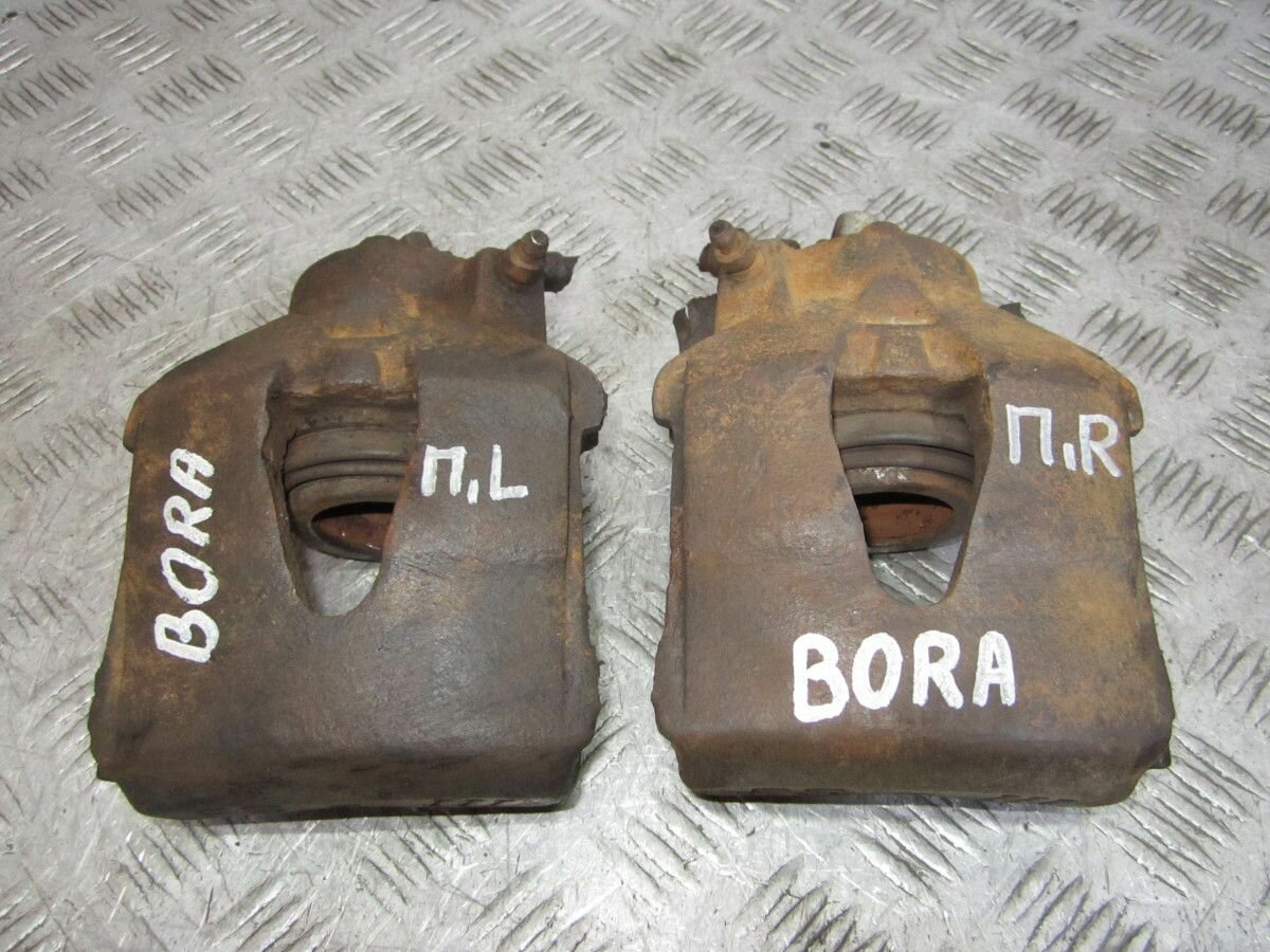 Суппорт тормозной передний Volkswagen Bora 1997-05