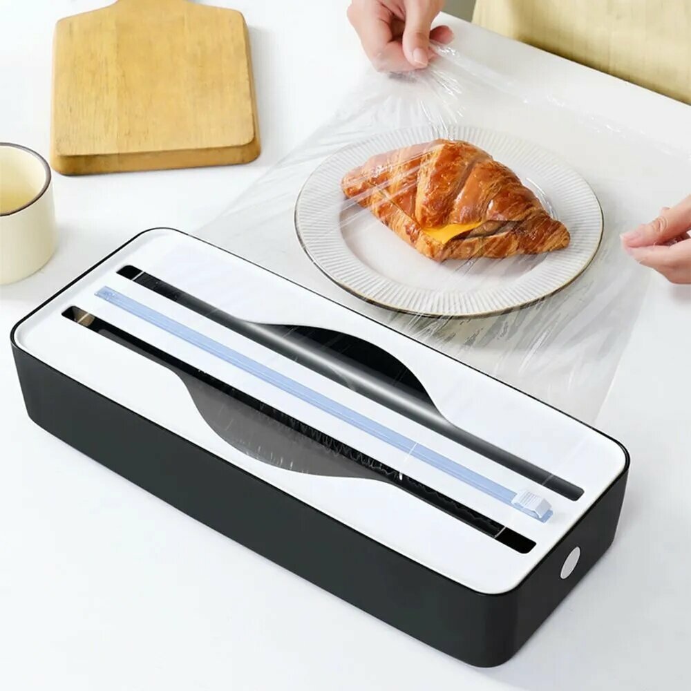 Резак для пищевой пленки с двумя прорезями, который можно одновременно заворачивать в фольгу и бумагу для выпечки - практичный кухонный аксессуар.