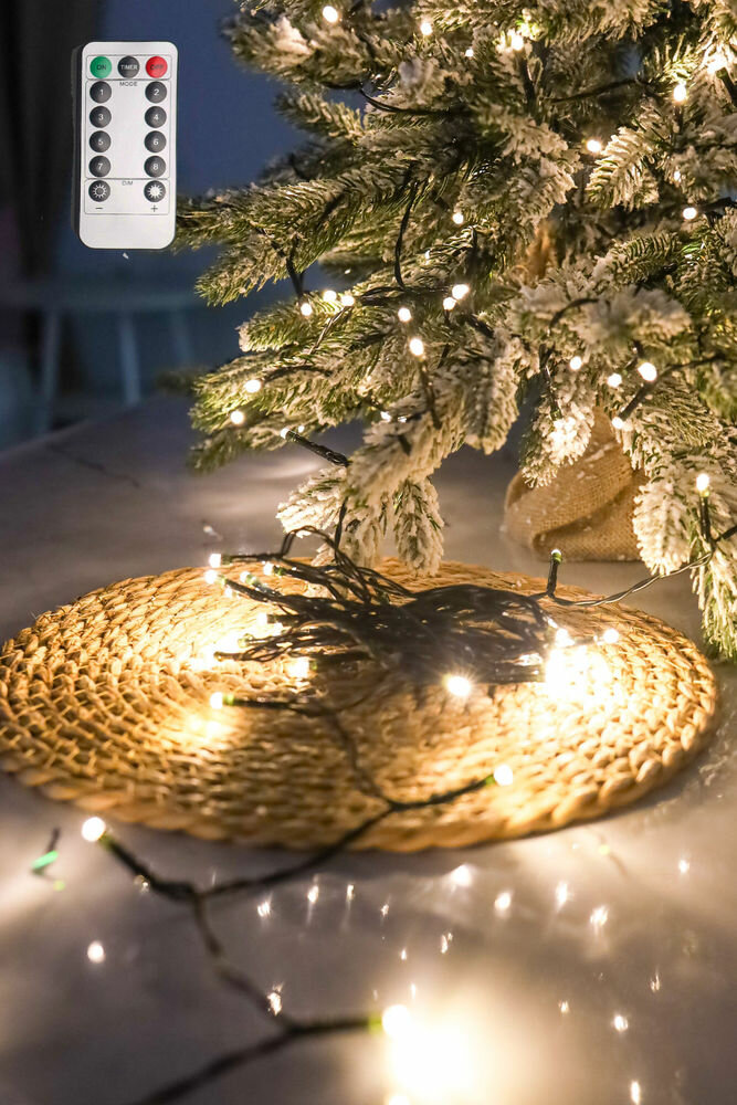 Светодиодная гирлянда на батарейках 120 теплых белых LED ламп 12 м, черный ПВХ, контроллер, пульт управления, IP44.