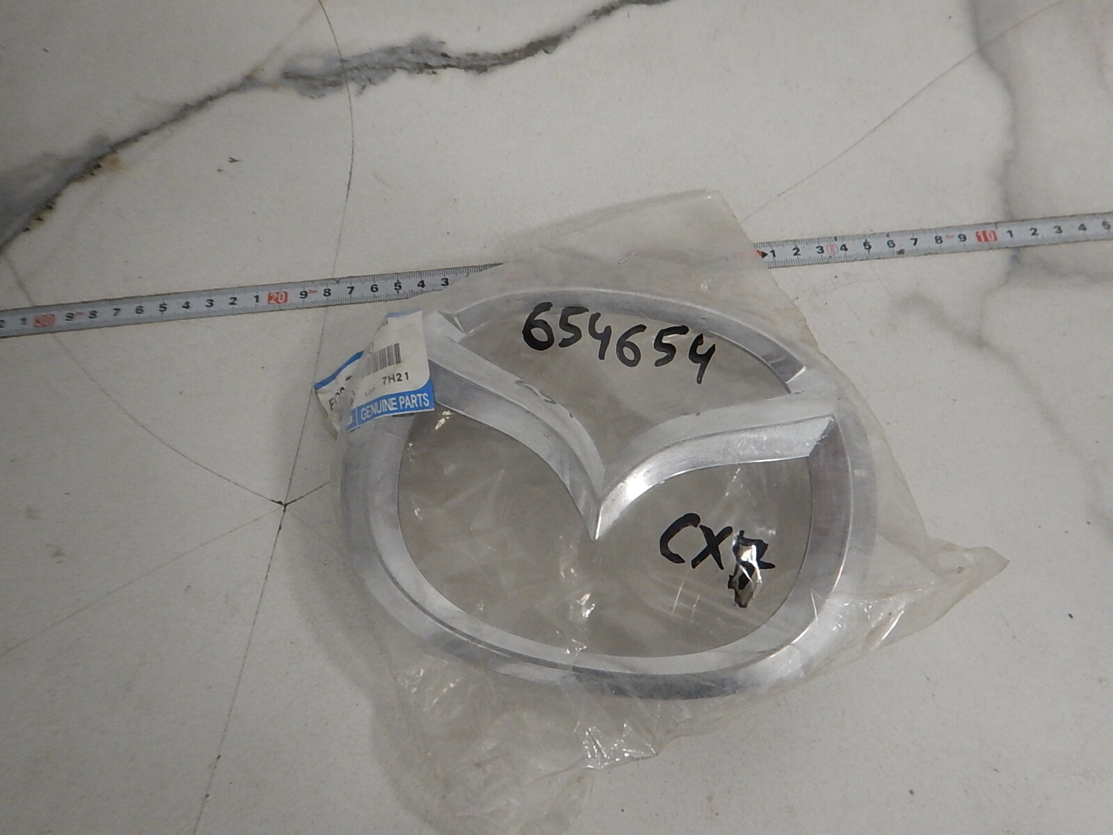 Б/У Эмблема, Mazda (Мазда)-CX-7 (07-) MAZDA CX-7 (07-) Новая. 654654 MAZDA арт. EG2151730