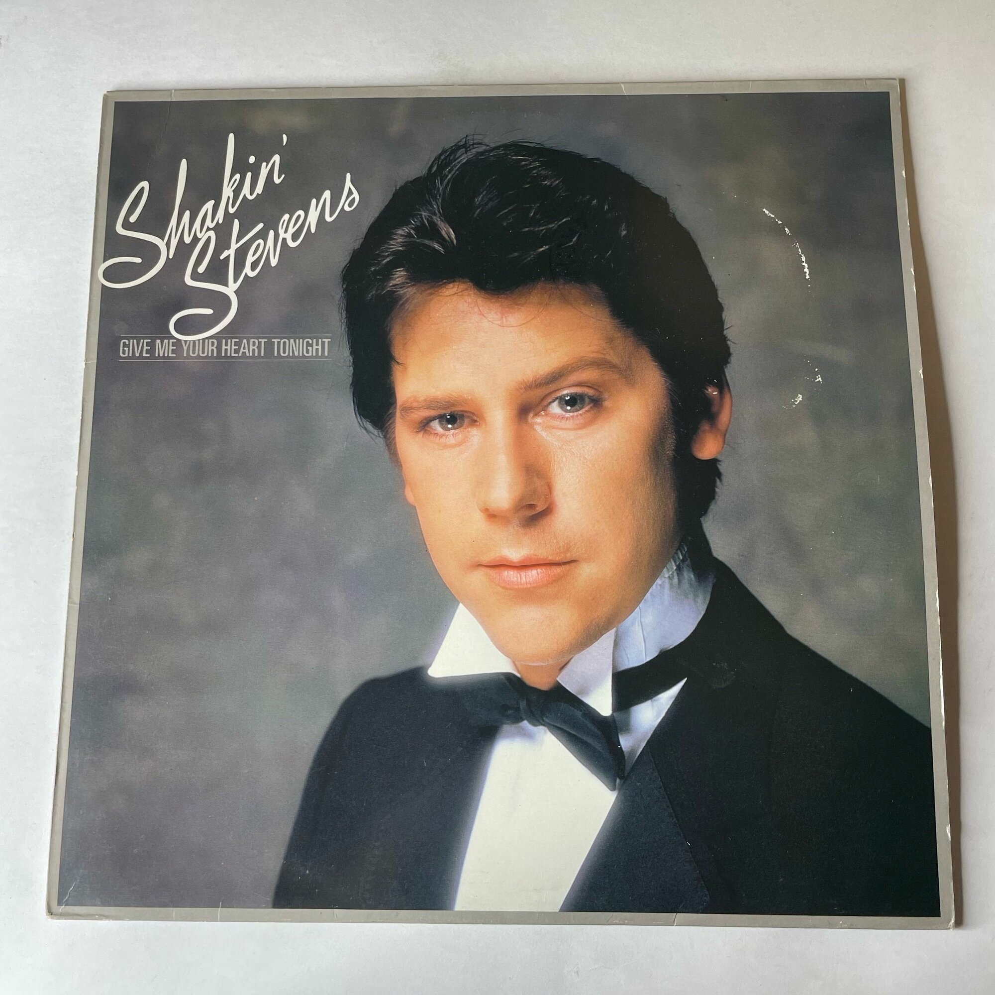 Винтажная виниловая пластинка LP Shakin Stevens Give Me Your Heart Tonight (Нидерланды 1983)