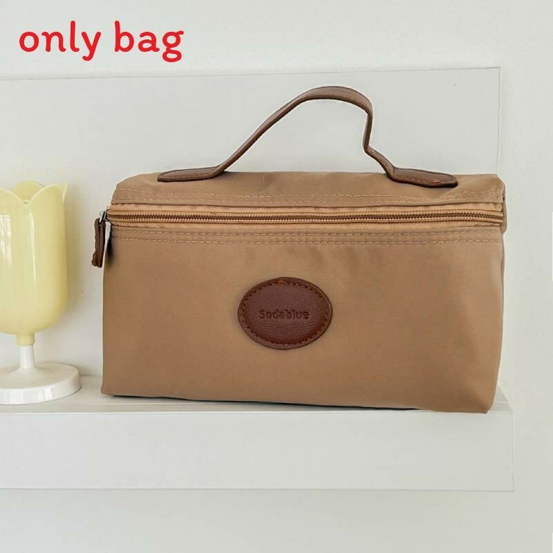 Wash bag leathertrim nylon with piping and zipper for travel and home use, brown