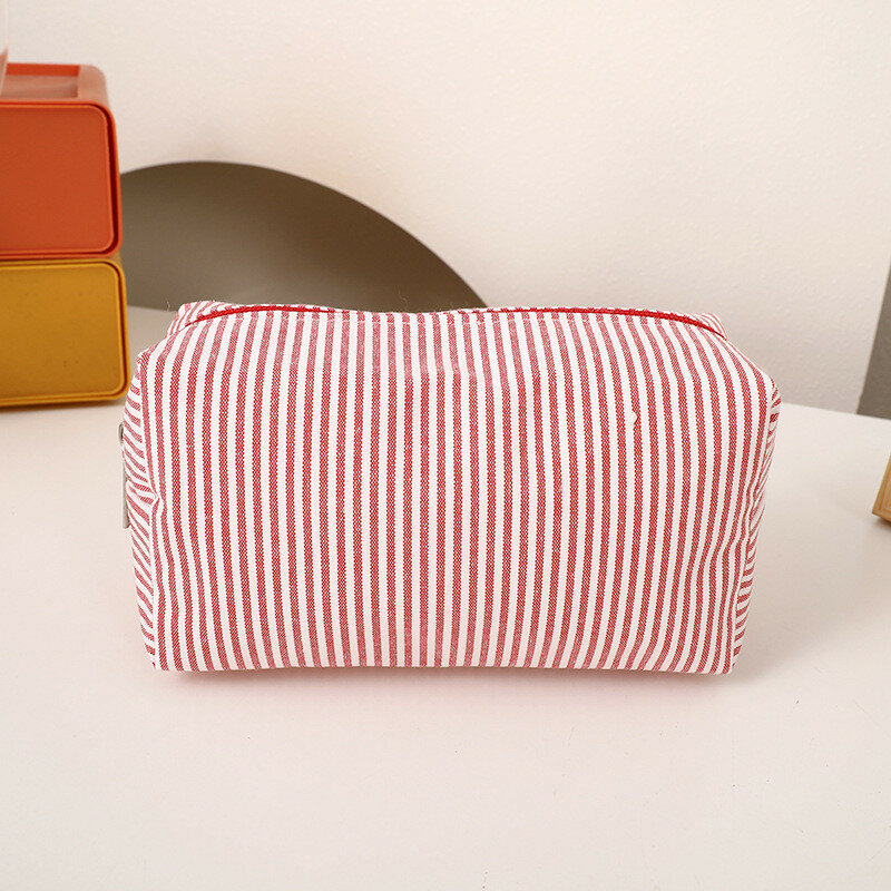 Stylish geometric triangle stationery pouch with striped material for students and office, red