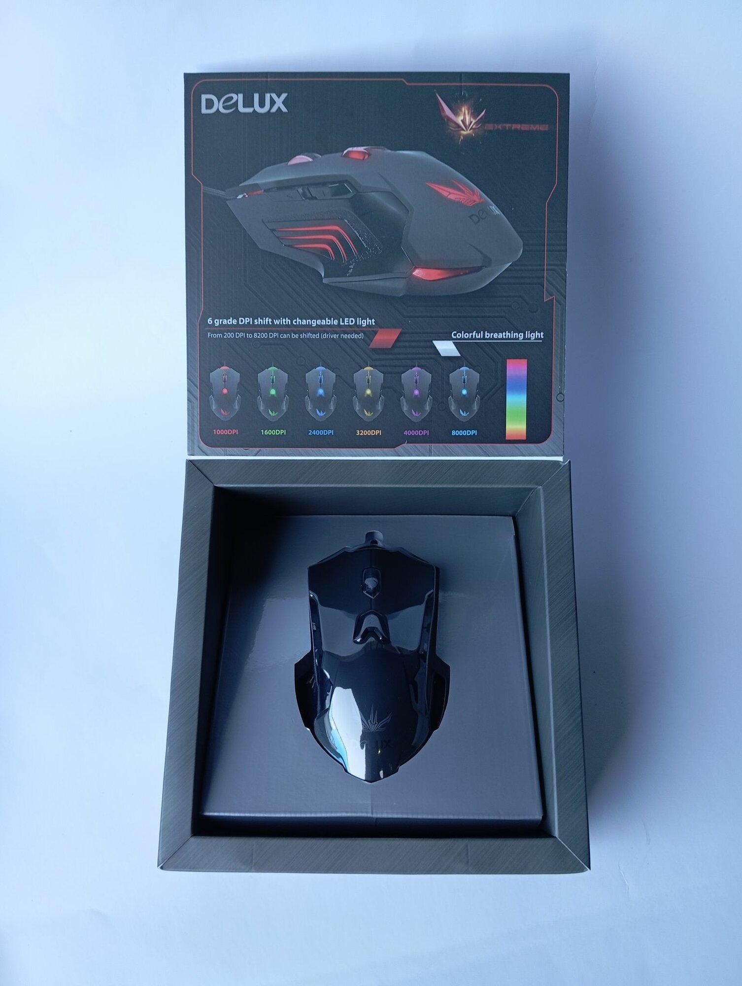 Мышь DELUX "M-811" , лазерная, (1000--8000 DPI), USB, (7кн+скролл), черная, с подсветкой