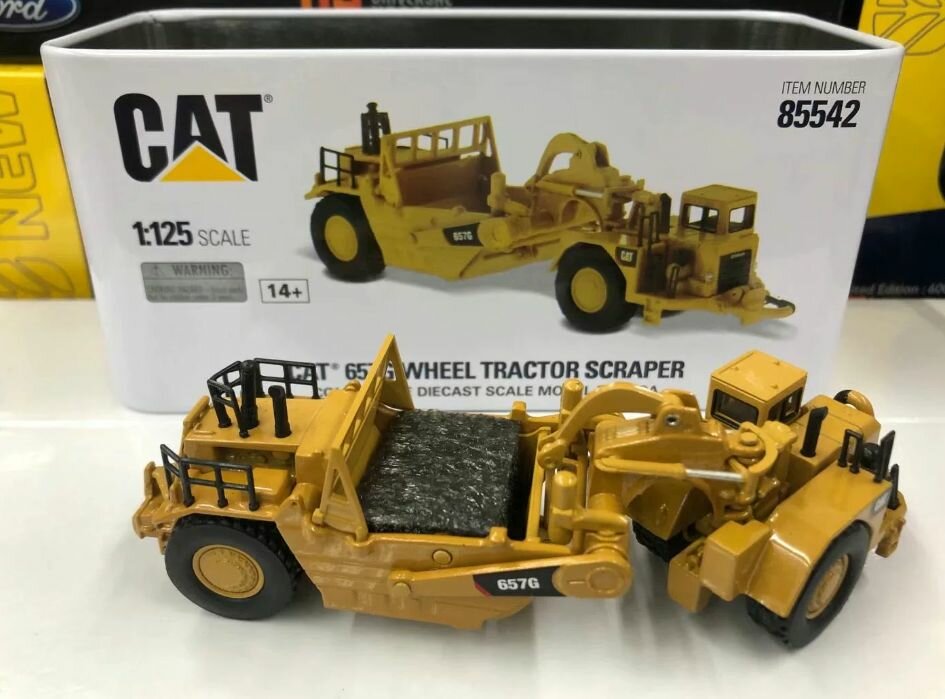Готовая модель колёсного скрепера CAT 657G в масштабе 1:125, Diecast Masters 85542