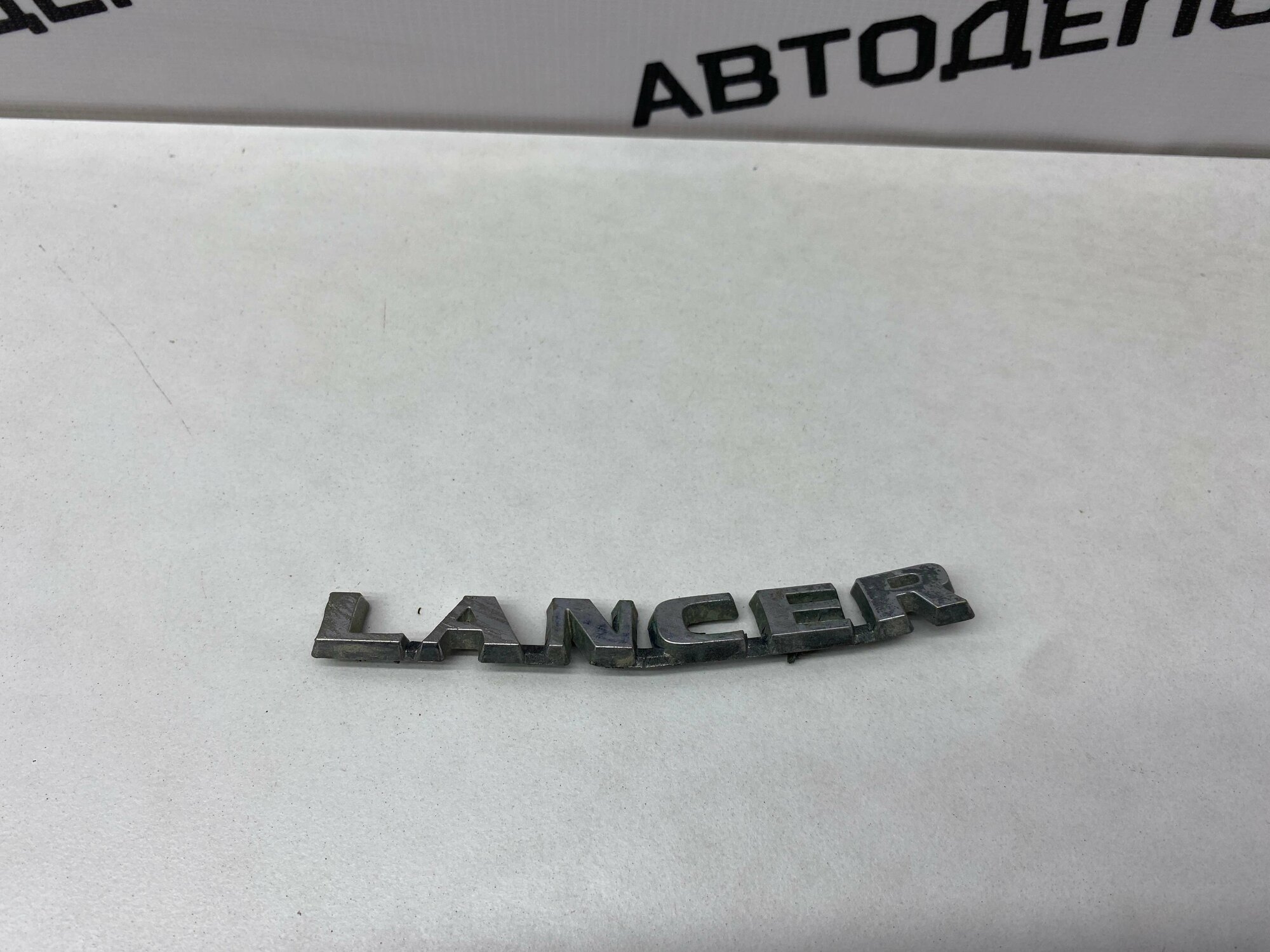 Эмблема Mitsubishi Lancer 9 2004 г