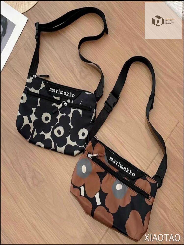 Сумка на плечо Marimekko с цветочным принтом, черная с белыми цветами, регулируемый ремень, для повседневного использования — фото 1