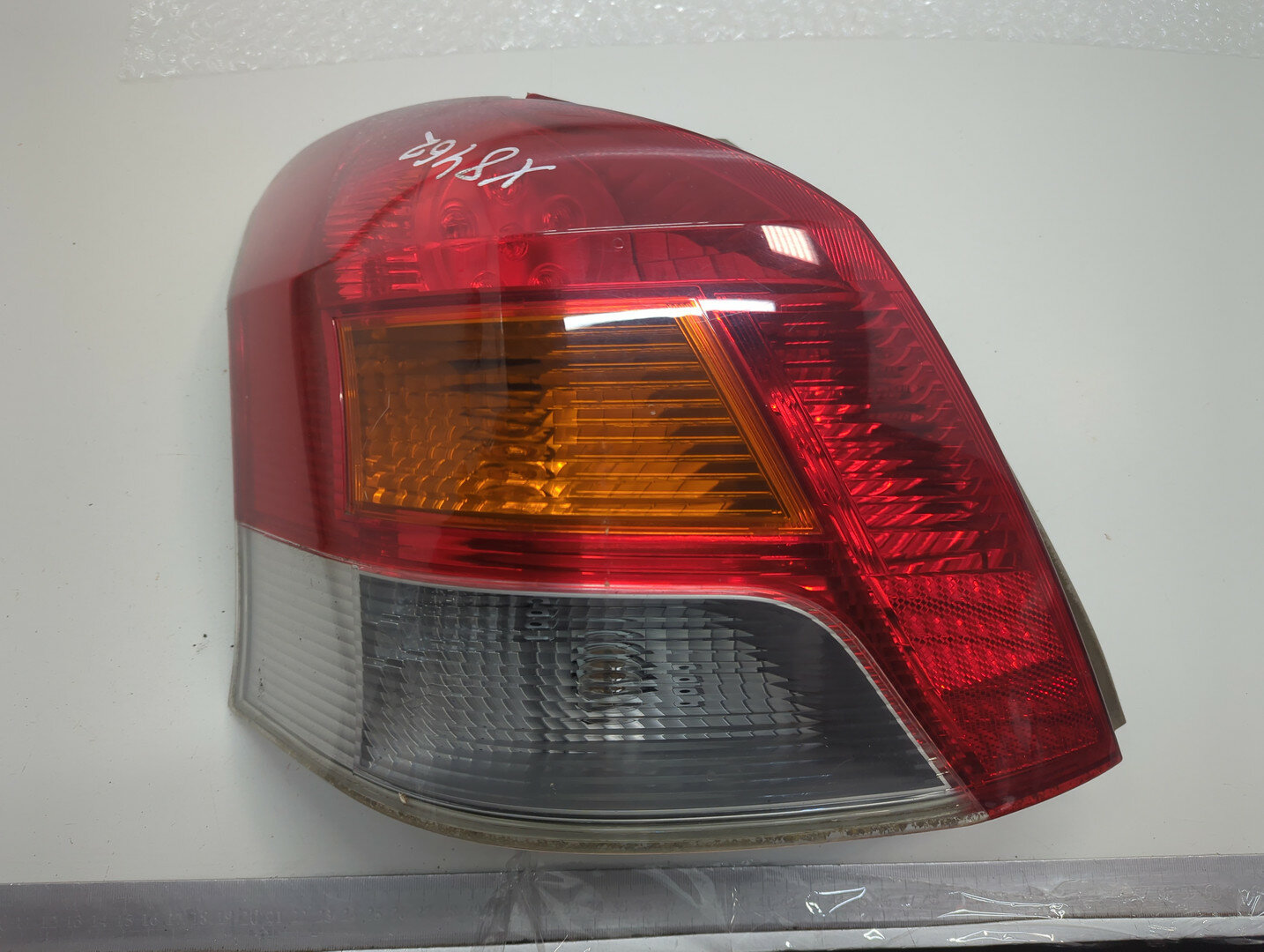 Фонарь (задний) левый Toyota Yaris Б/У
