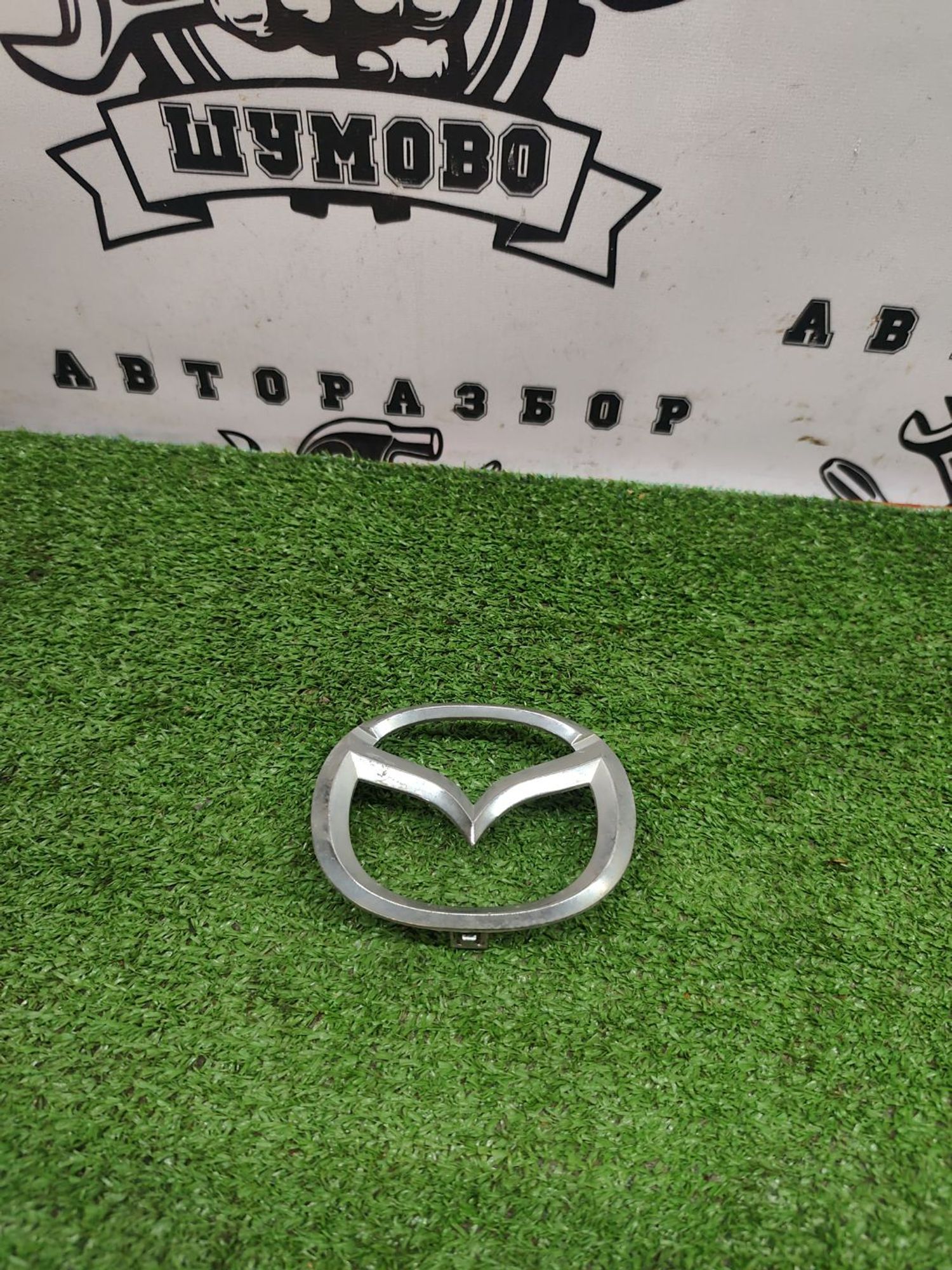 Эмблема Mazda Demio, II (DY) 2003 с пробегом