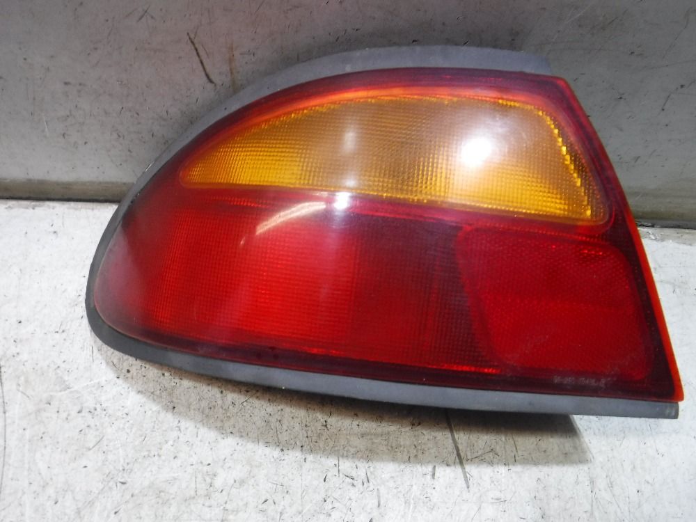 Фонарь задний левый Mazda 323 BA