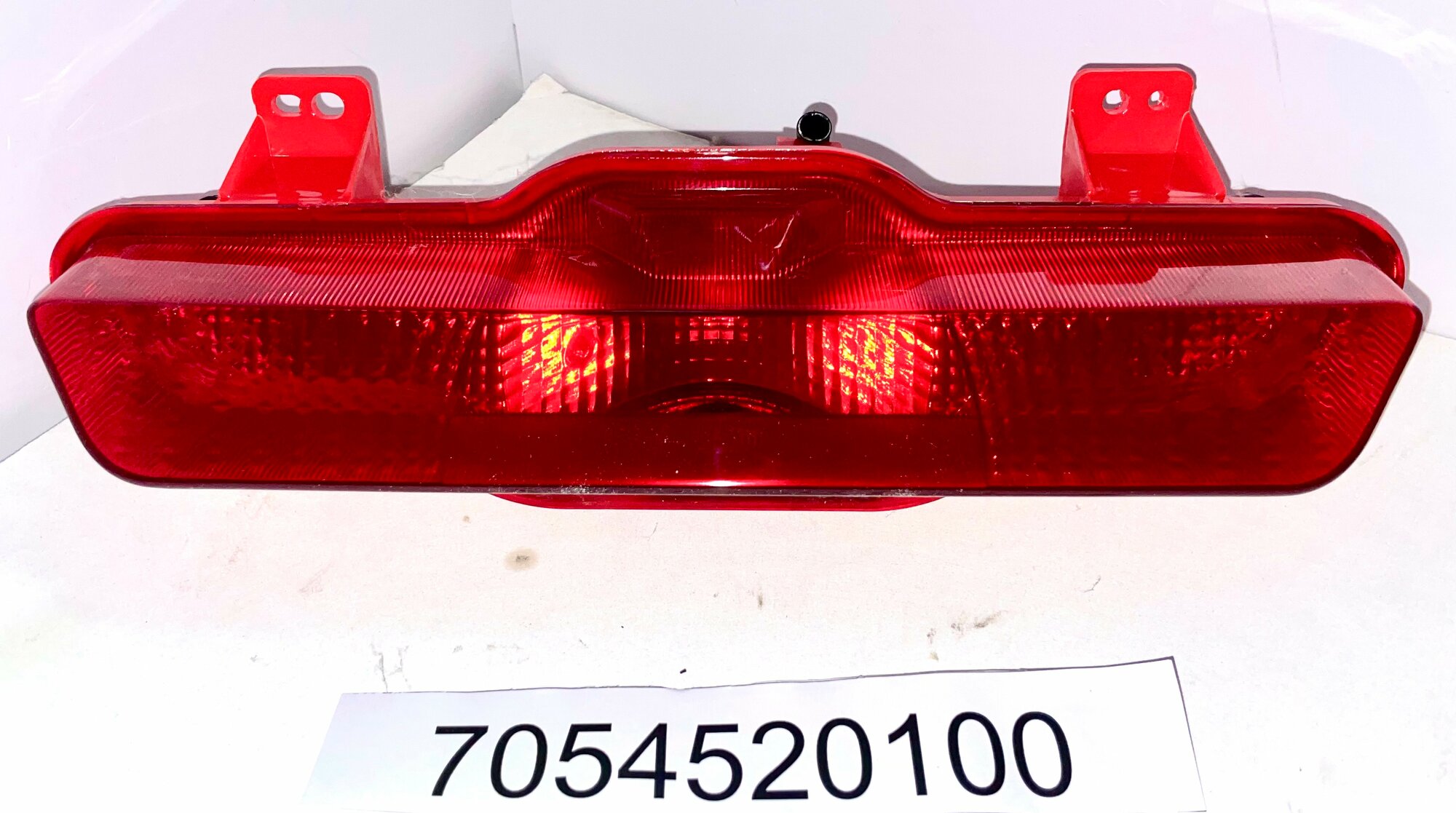 Противотуманная фара задняя центральная EMGRAND 7 Geely 7054520100