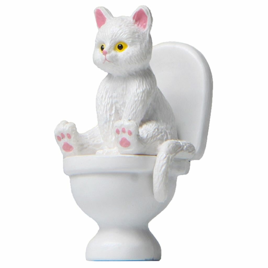 Внутреннее убранство рабочего стола, Кошка в туалете в сидячем положении - белая