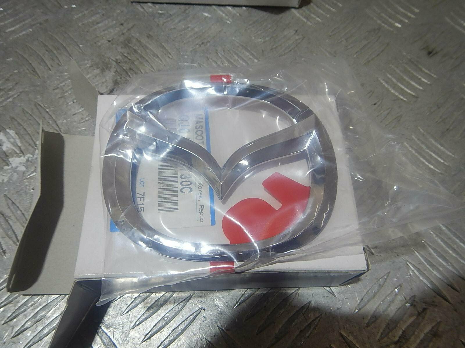 Б/У Эмблема, Mazda (Мазда)-6 (GG) (02-07) MAZDA 6 (GG) (02-07) Новая 334644 MAZDA арт. GJ6J51730C