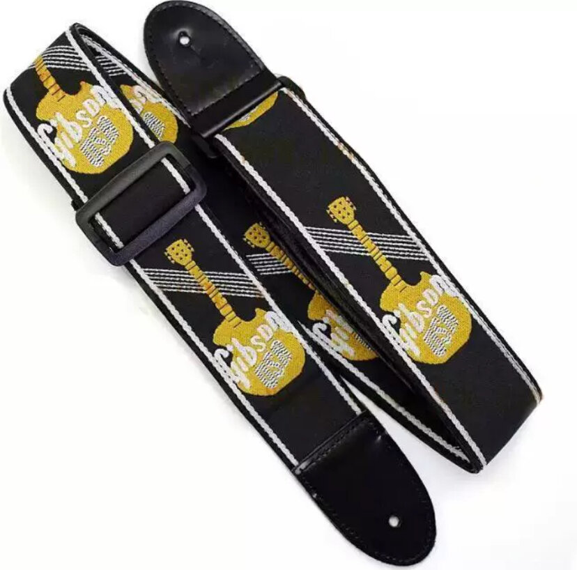 Гитарный ремень Gibson ASGG -600 Woven Strap W/Gibson Logo, черный с желтым