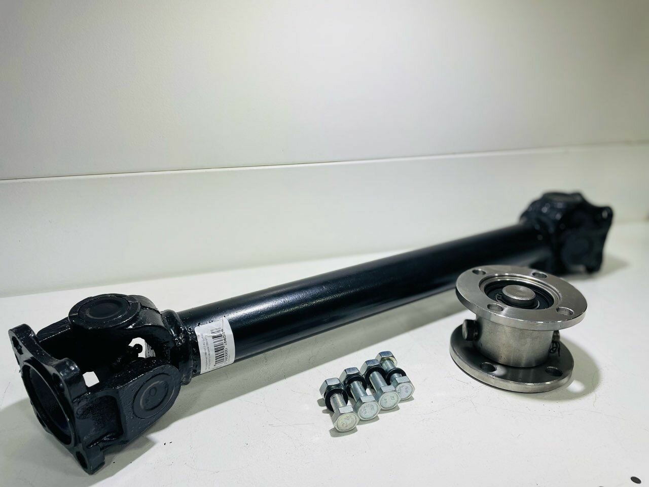 Вал карданный МТЗ-82 переднего моста (4 отверстия) L-566 мм с муфтой отключения ПВМ