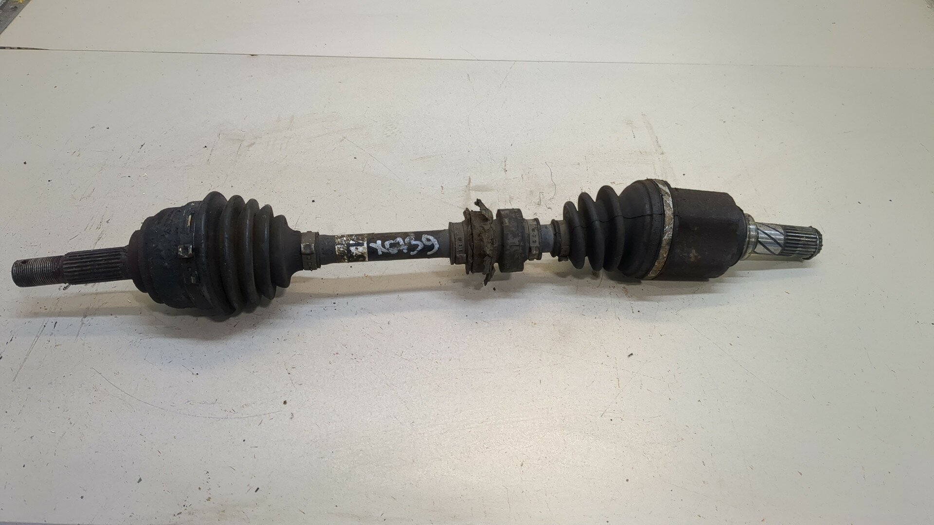 Полуось (вал, шрус) левая передняя Nissan Note E12 Б/У