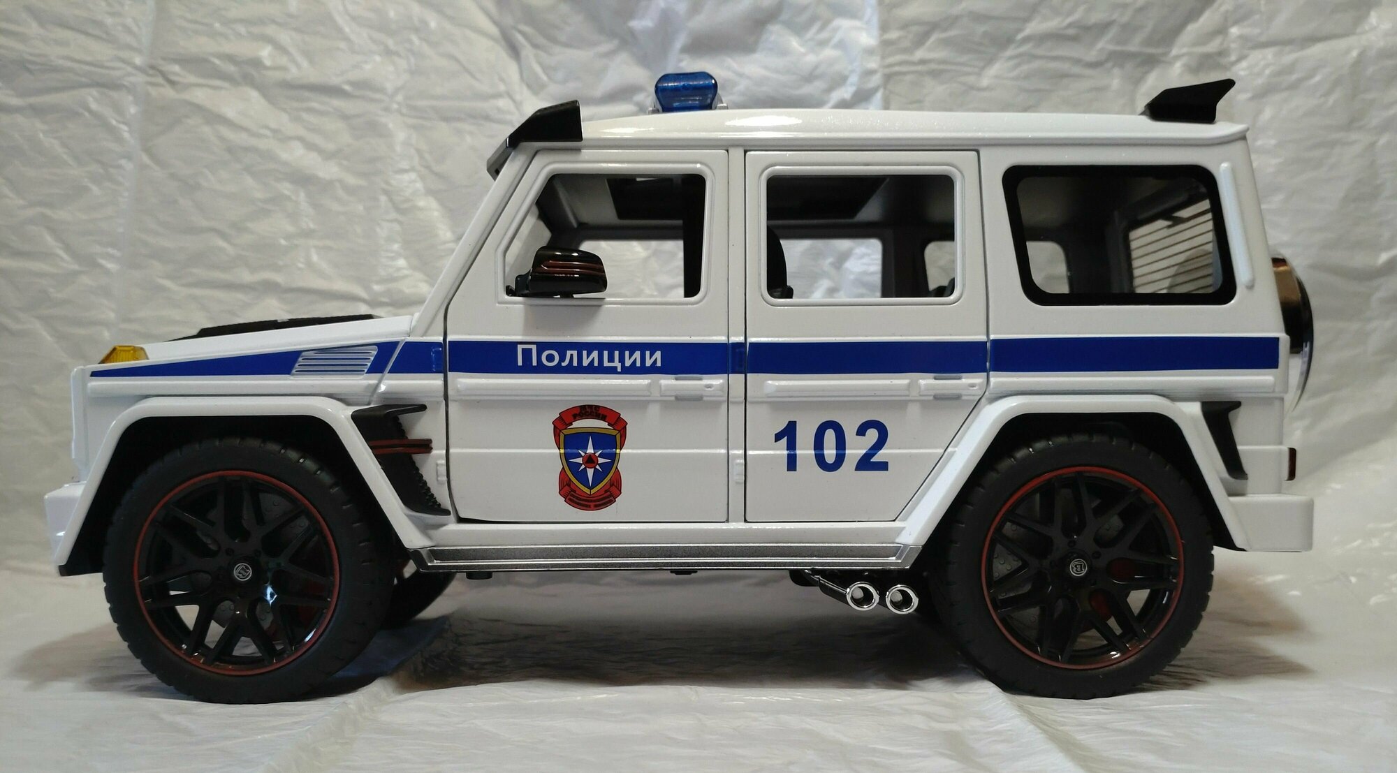 Модель машины Mercedes-Benz G-класса G63 AMG Мерседес Бенц Гелик ДПС, масштаб 1:18, длина 28 см.
