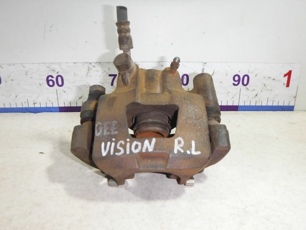 Суппорт задний левый Geely Vision 1061001405