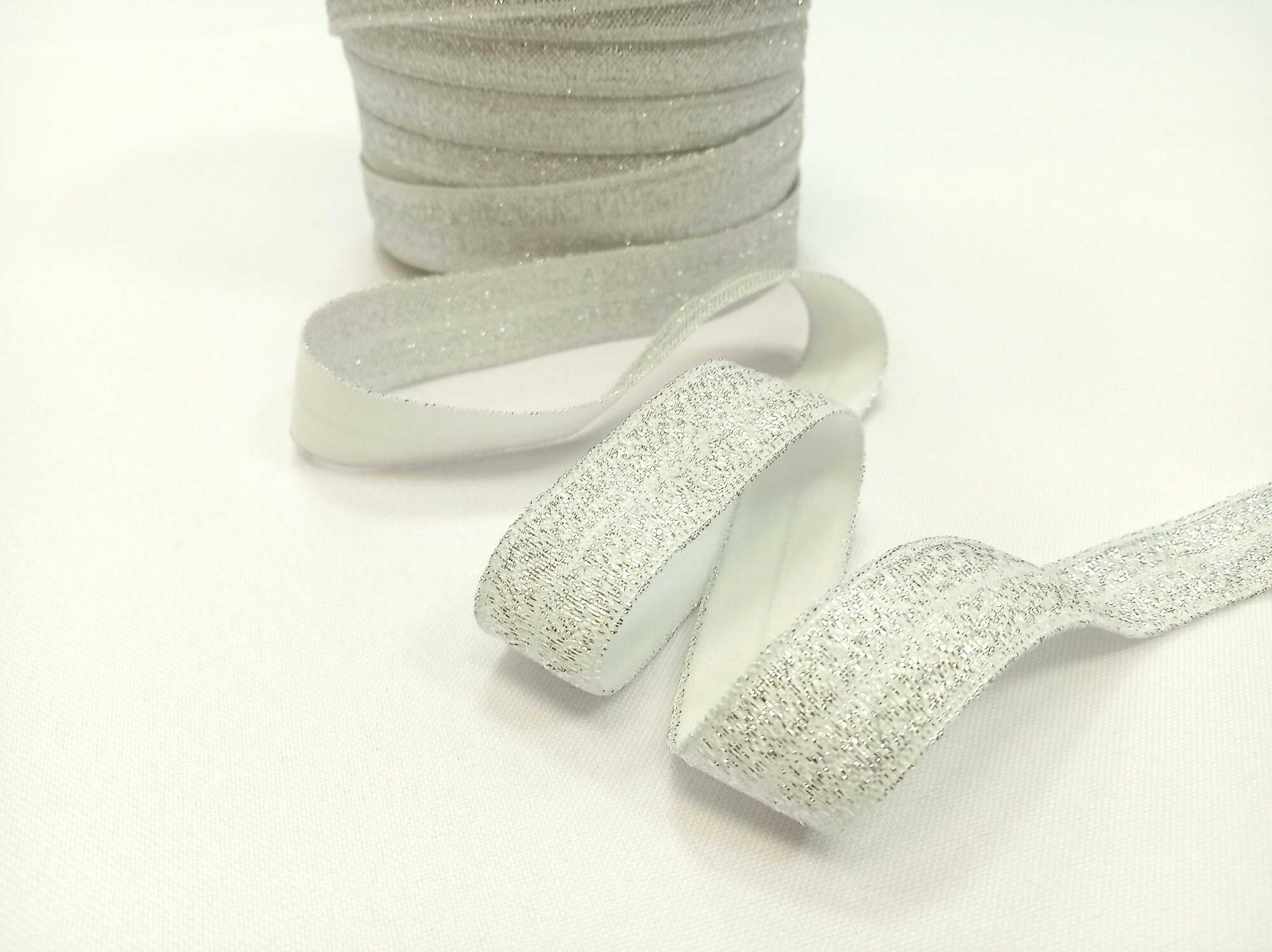 Резинка окантовочная (бейка эластичная) с люрексом 15мм белая с серебром 5 м.