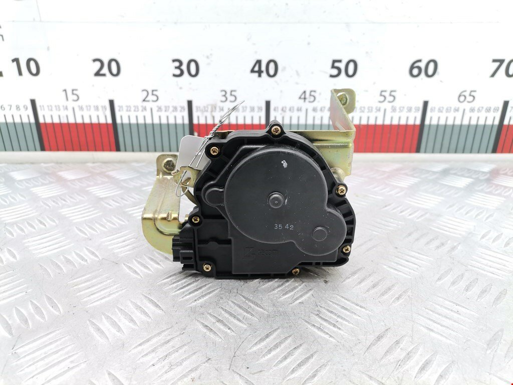 Сервопривод (электропривод моторчик привода) лючка бензобака Opel Frontera B арт. 2031534