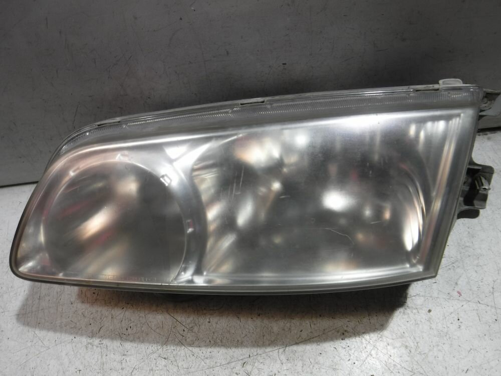 Фара левая Hyundai Starex 921014A000