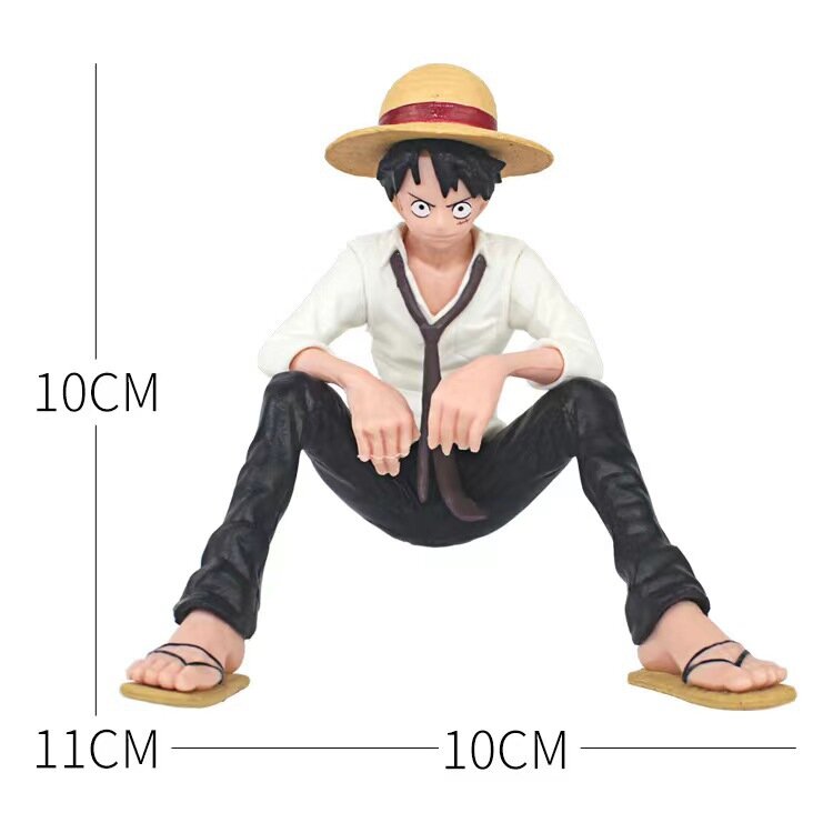 Фигурка Луффи из аниме One Piece в сидячей позе, высотой приблизительно 10 см.