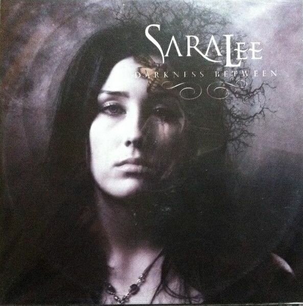 Saralee. Darkness Between (Promo, Finland, Firebox Records, Firecd037, 2006, Cardboard Sleeve) CD