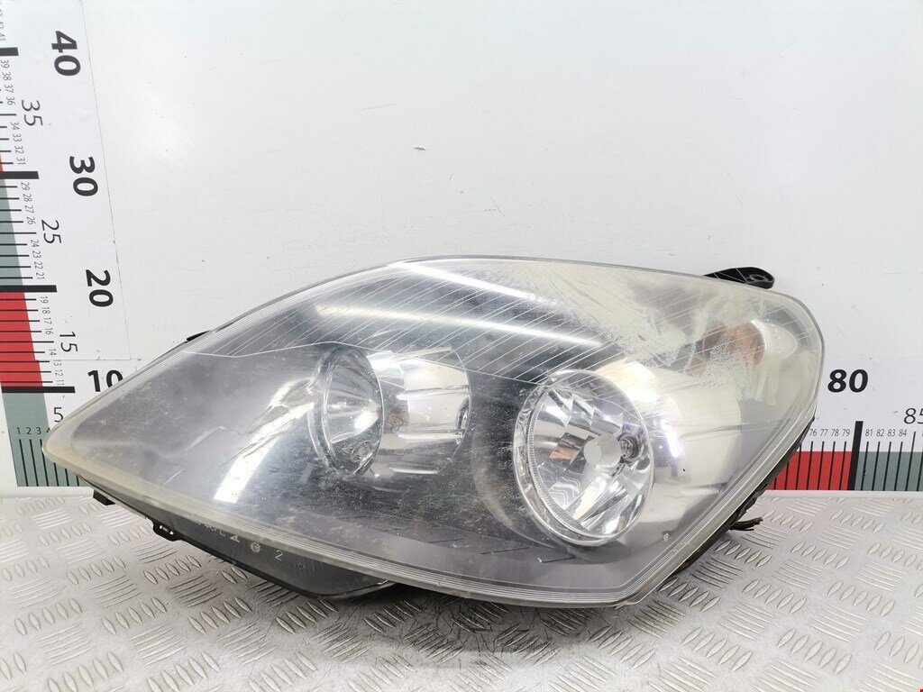 Фара левая Opel Zafira B 93190408 арт. 2157716