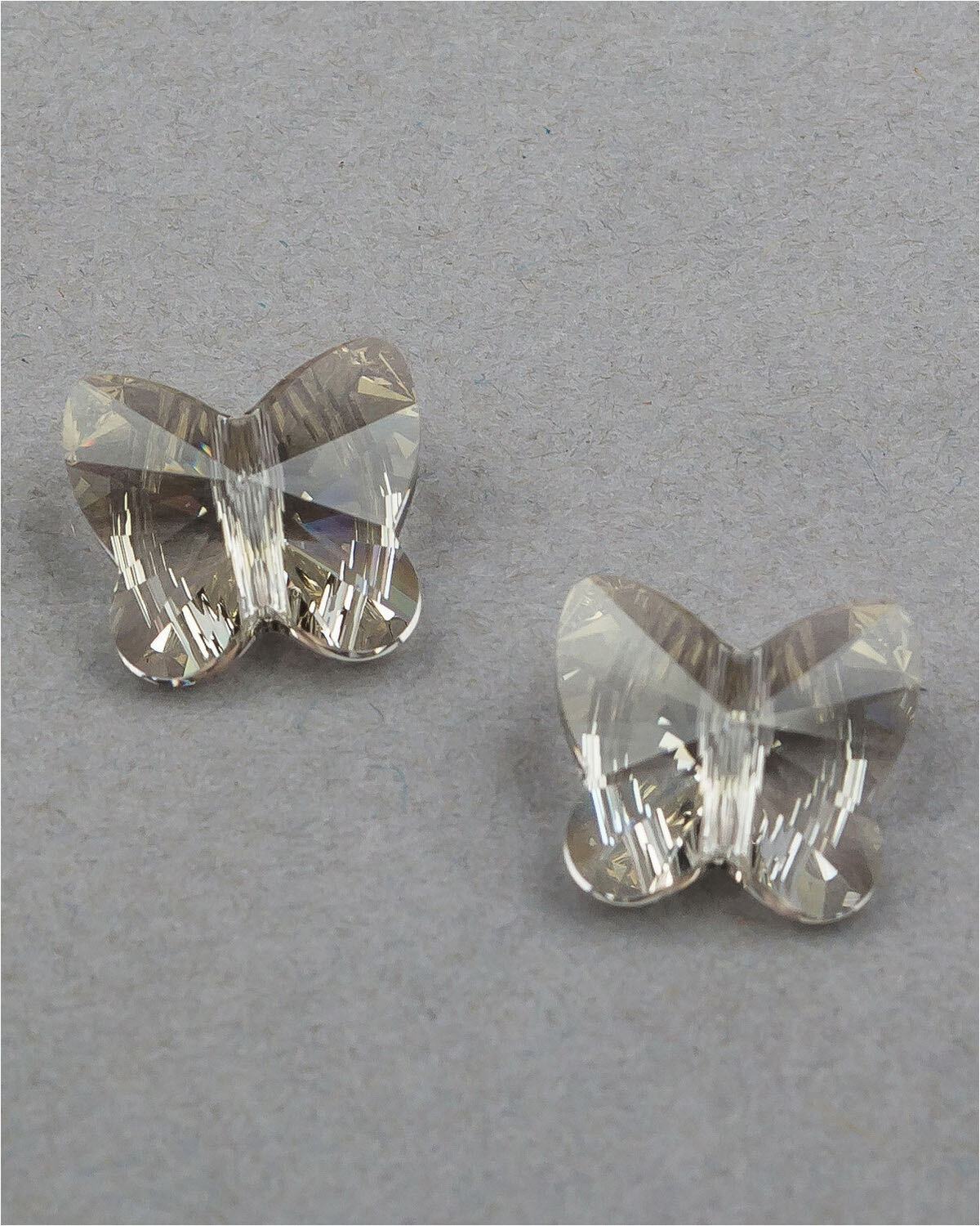 Бусины Swarovski в виде бабочек из стекла, цвет Crystal Silver Shade (#001-SSHA), размер 12 мм, 2 шт.