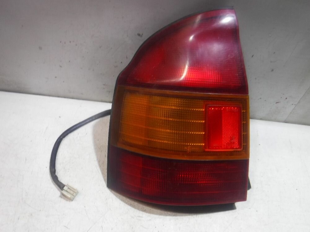 Фонарь задний левый Mazda 323 BA BG3B51180C