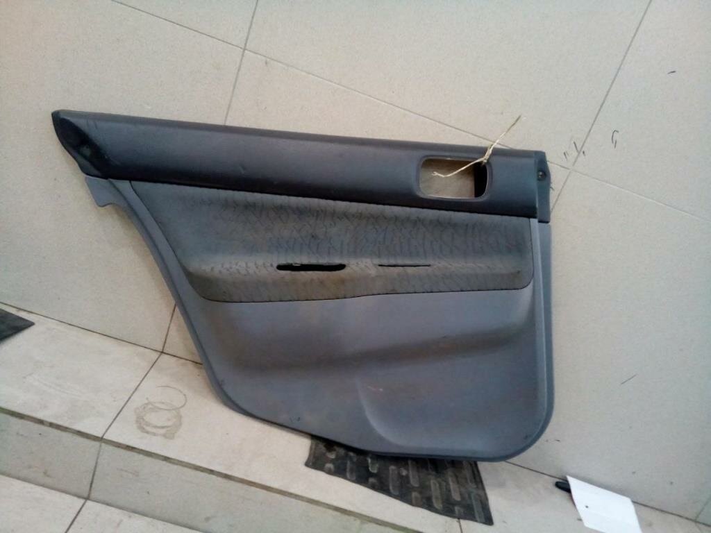 Обшивка двери задней левой от Mitsubishi Lancer Cedia CS 2000-2003