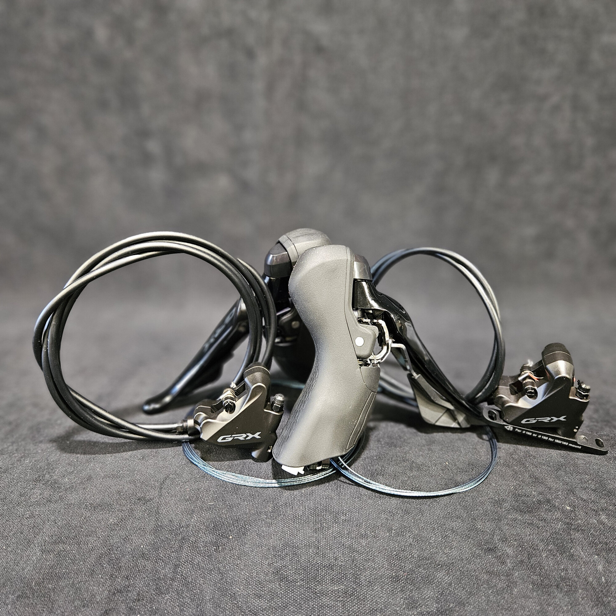 Комплект пистолетов Shimano GRX ST-RX400 (гидравлика), 2 / 10 ск, калиперы GRX BR-RX400 (колодки - K05S), гидролиния 800 / 1600 мм, J-kit (OEM без упаковки)