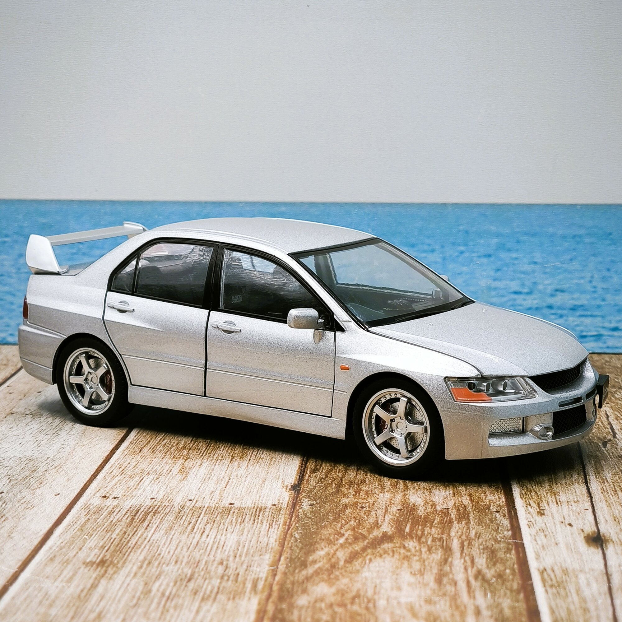 Машинка металлическая Mitsubishi Lancer Evolution с свето-звуковым сопровождением. Масштаб 1:24. Митсубиси Лансер