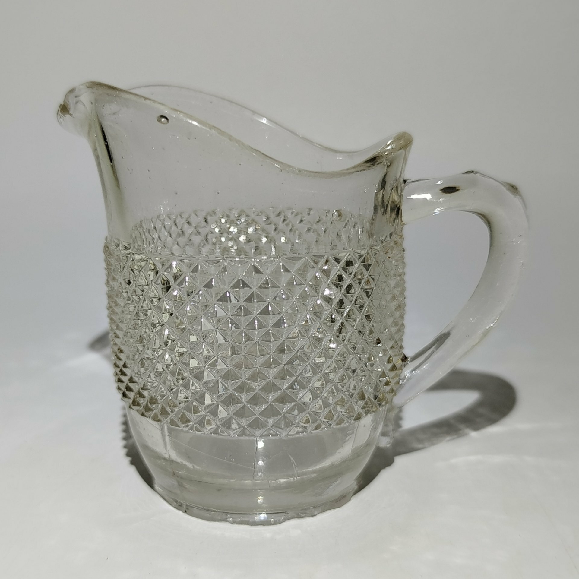 Молочник с рельефным декоративным пояском, стекло, пресс, Россия, 1900-1930 гг.