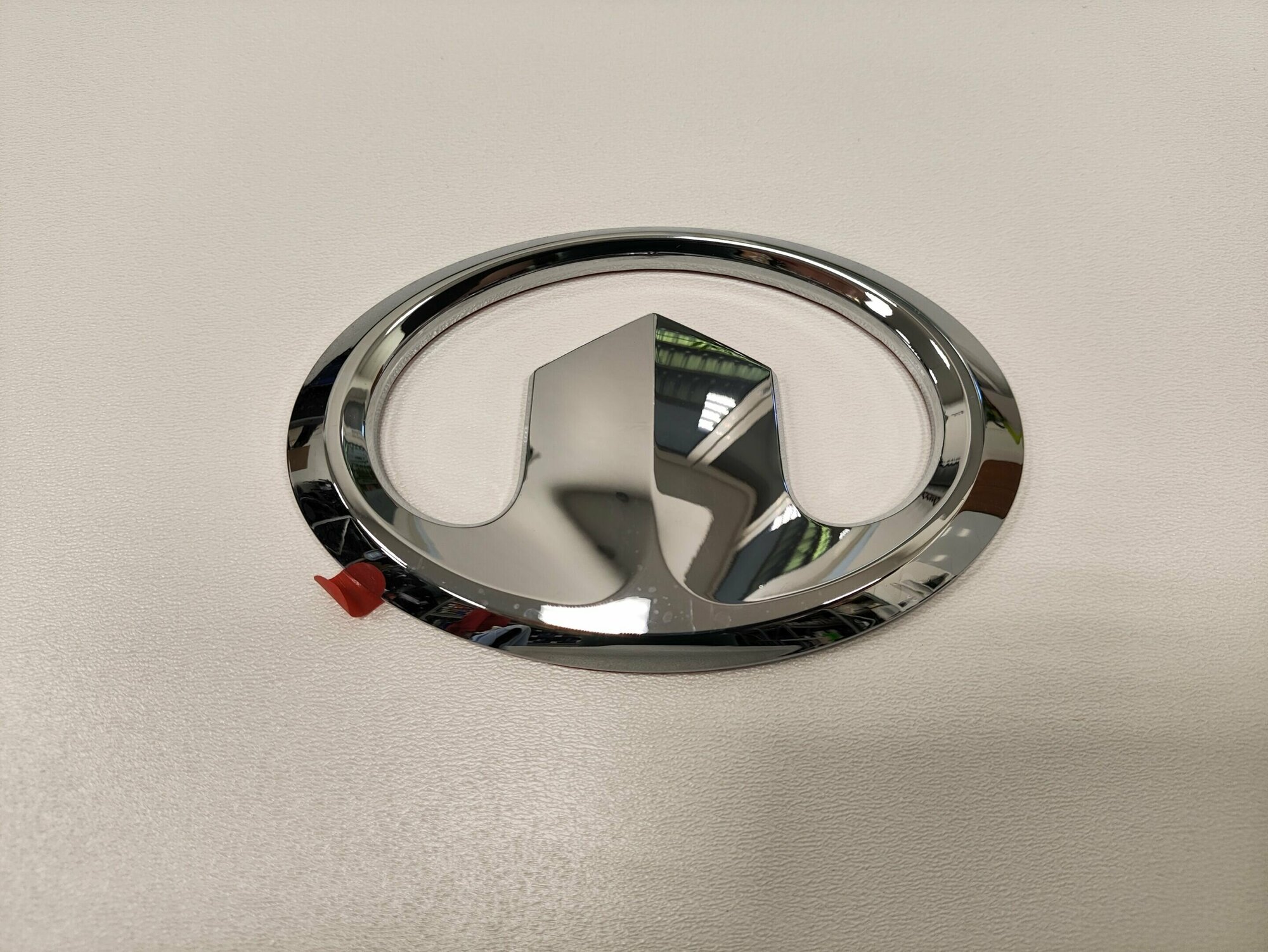 Эмблема решетки радиатора (нового образца) Great Wall Hover [2.4 16V 5MT внедорожник 4X2 бензин] 3921011K00B1