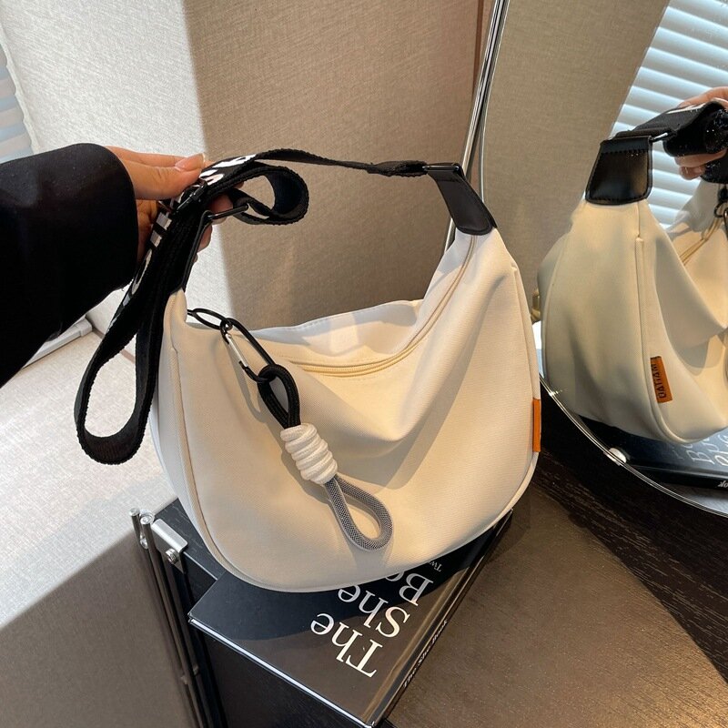 Женская сумка 2025 года, новая модель из оксфордской ткани, сумка-пельмень, повседневная спортивная сумка с большой вместимостью, широким плечевым ремнем, сумка через плечо для женщин.